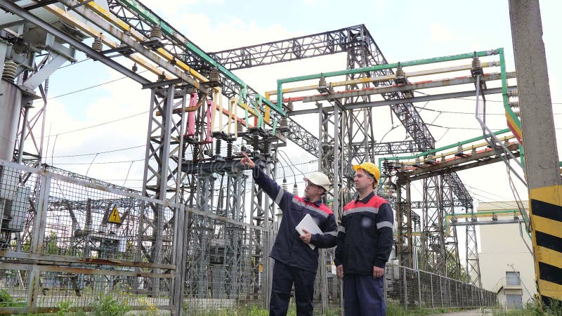 Two Engineer Working on Checking and Maintenance Equipment of the ...