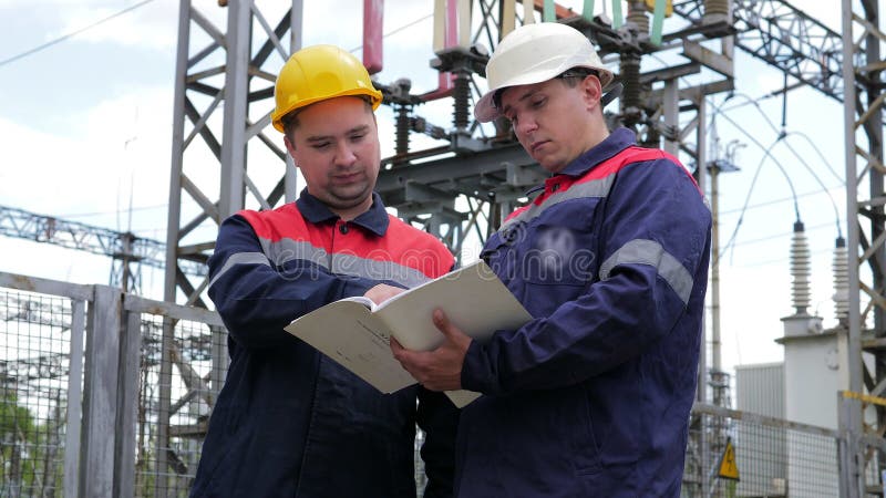 Two Engineer Working on Checking and Maintenance Equipment of the ...