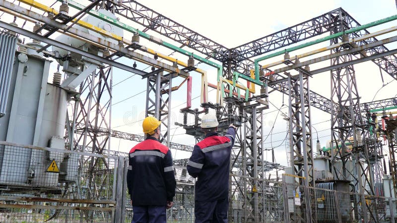 Two Engineer Working on Checking and Maintenance Equipment of the ...