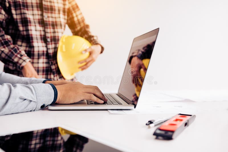Two Engineering Man Working with Laptop and Discussing Project Together ...