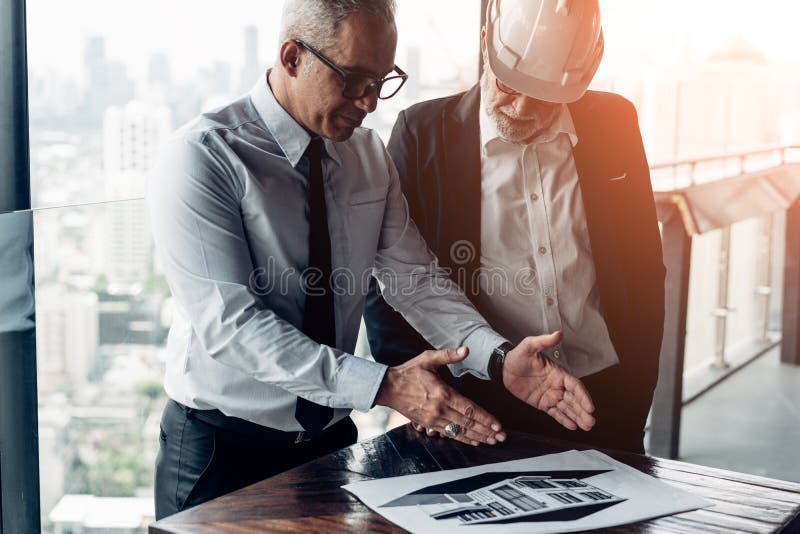 Engineer People Meeting Working and Pointing at a Drawings in Office ...