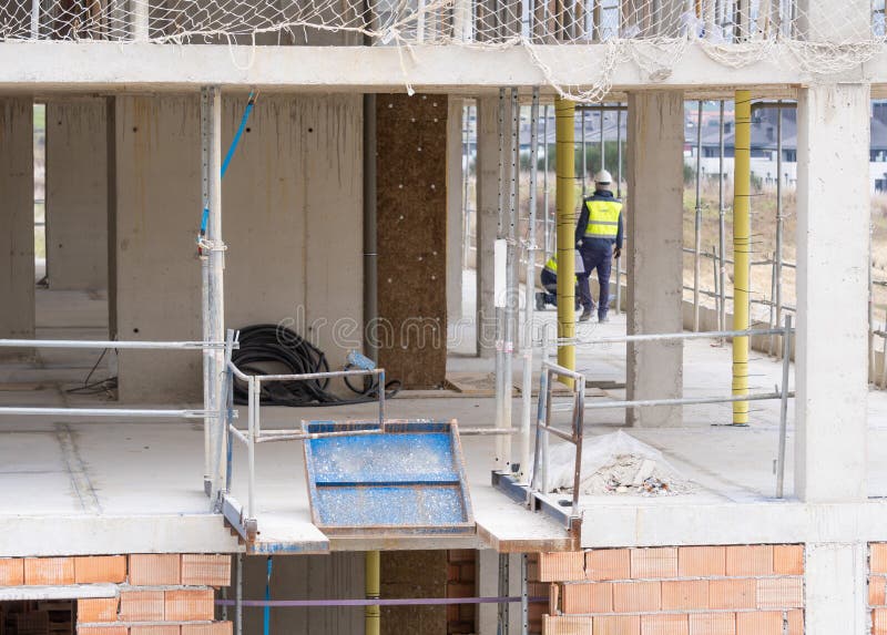 Two Engineers Checking an Apartment Building Site Under Construction ...