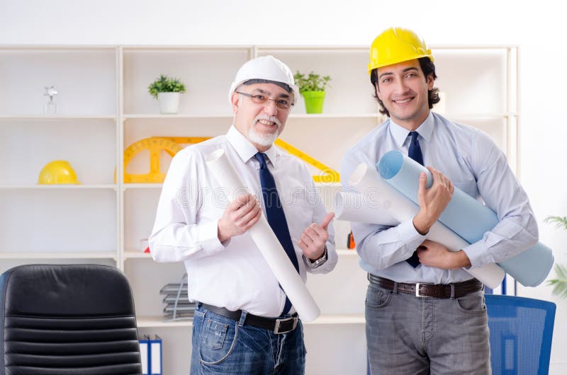 The Two Engineers Colleagues Working Under Project Stock Image - Image ...