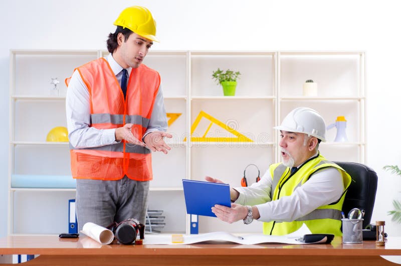 The Two Engineers Colleagues Working Under Project Stock Image - Image ...