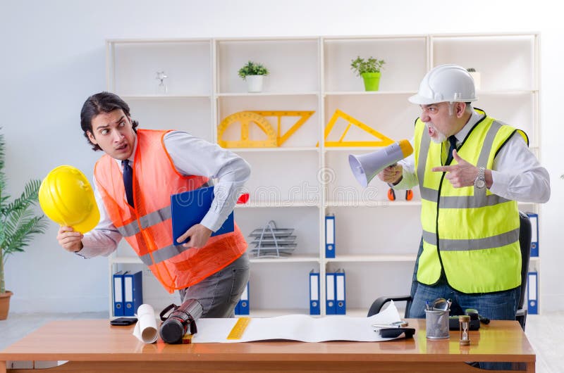 The Two Engineers Colleagues Working Under Project Stock Photo - Image ...