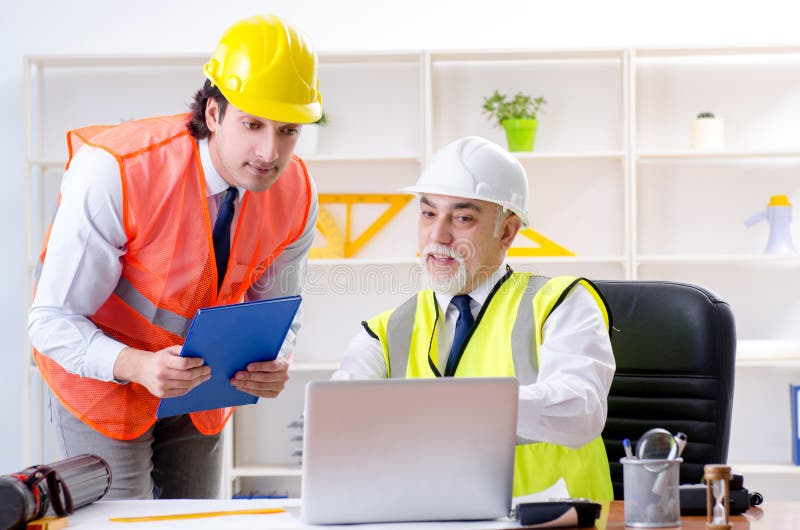 The Two Engineers Colleagues Working Under Project Stock Image - Image ...
