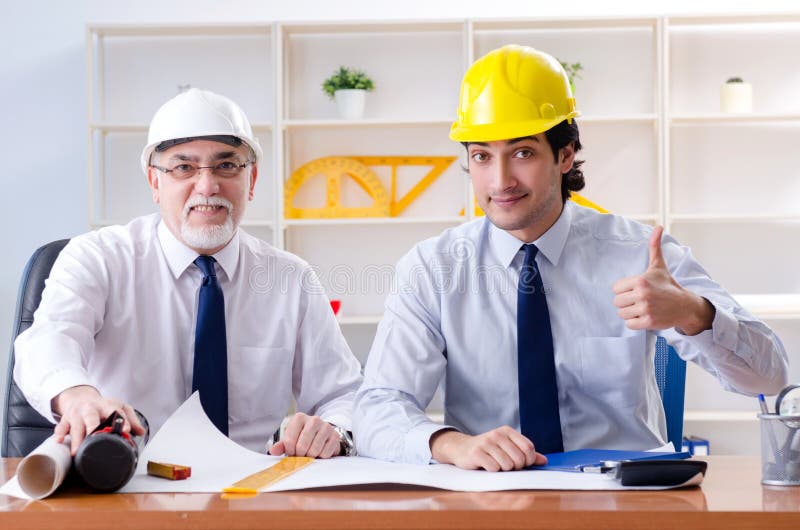 The Two Engineers Colleagues Working Under Project Stock Photo - Image ...