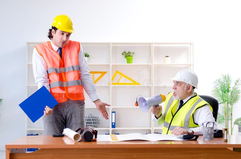 The Two Engineers Colleagues Working Under Project Stock Image - Image ...