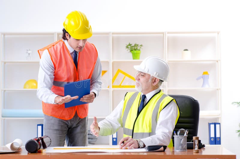 The Two Engineers Colleagues Working Under Project Stock Image - Image ...