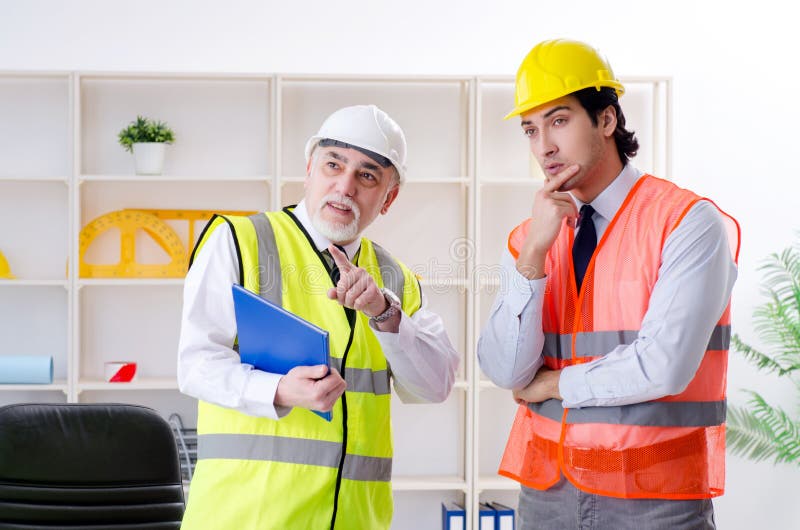 The Two Engineers Colleagues Working Under Project Stock Photo - Image ...