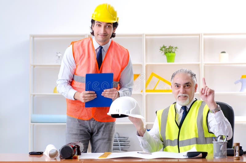The Two Engineers Colleagues Working Under Project Stock Image - Image ...