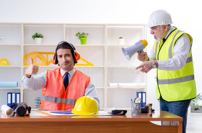 The Two Engineers Colleagues Working Under Project Stock Image - Image ...