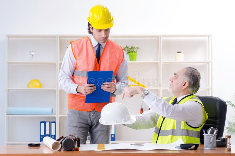 The Two Engineers Colleagues Working Under Project Stock Image - Image ...