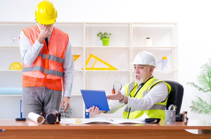 The Two Engineers Colleagues Working Under Project Stock Image - Image ...