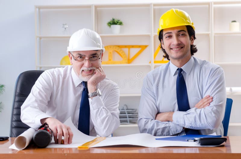 The Two Engineers Colleagues Working Under Project Stock Image - Image ...