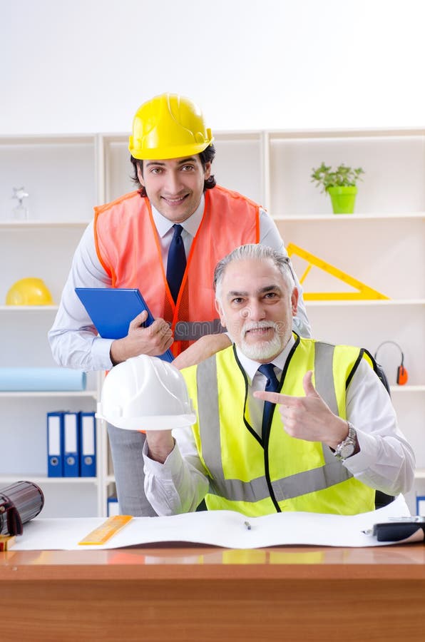 The Two Engineers Colleagues Working Under Project Stock Photo - Image ...