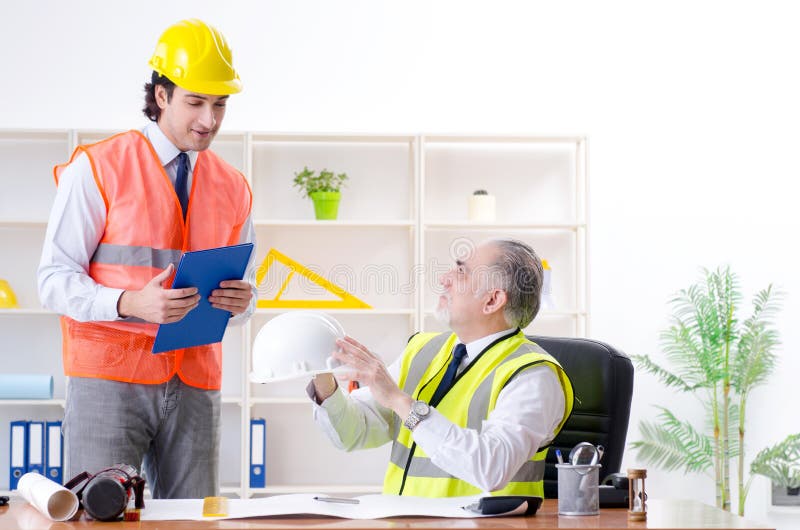 Two Engineers Colleagues Working Under Project Stock Photo - Image of ...