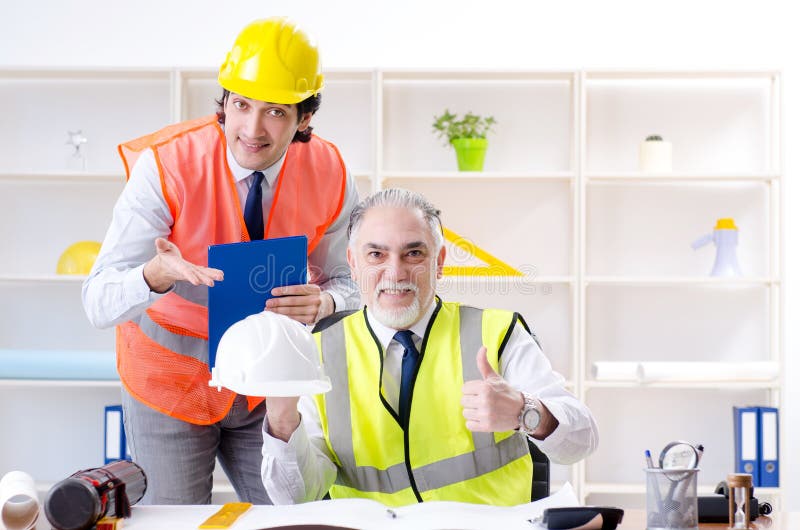 The Two Engineers Colleagues Working Under Project Stock Photo - Image ...