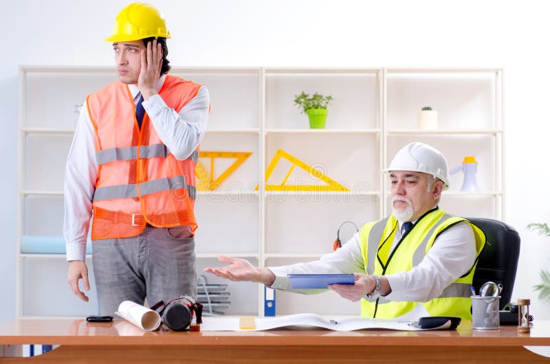 The Two Engineers Colleagues Working Under Project Stock Image - Image ...