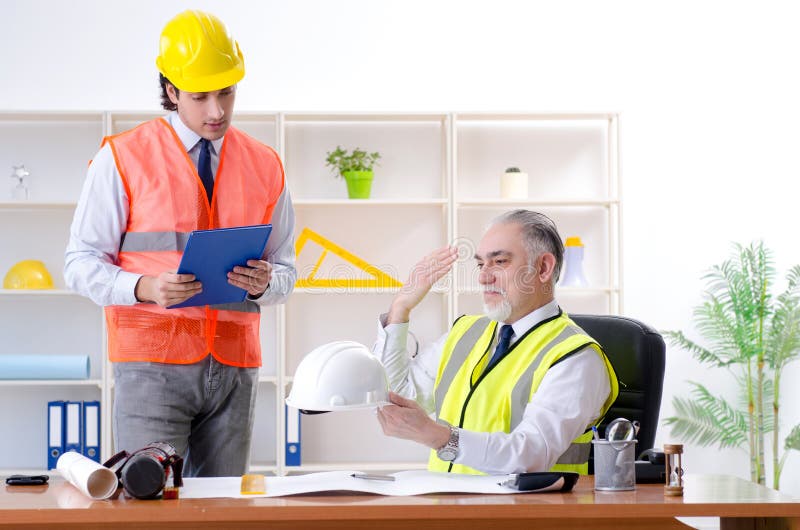 Two Engineers Colleagues Working Under Project Stock Photo - Image of ...