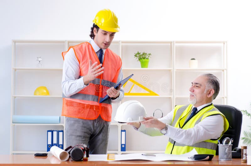 Two Engineers Colleagues Working Under Project Stock Image - Image of ...