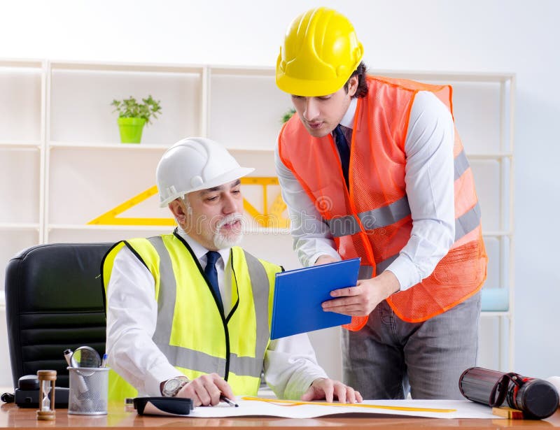 Two Engineers Colleagues Working Under Project Stock Photo - Image of ...