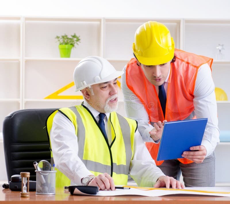 Two Engineers Colleagues Working Under Project Stock Photo - Image of ...