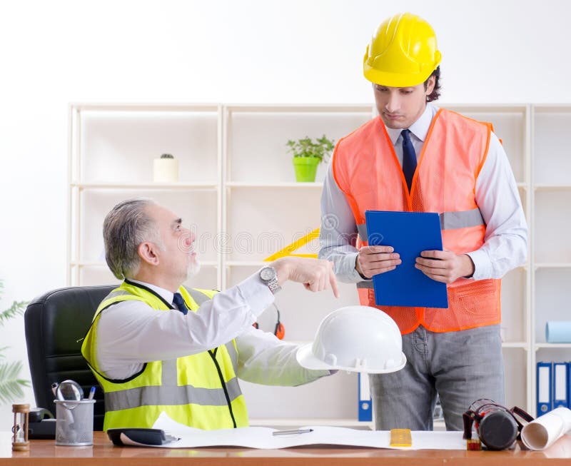 Two Engineers Colleagues Working Under Project Stock Image - Image of ...