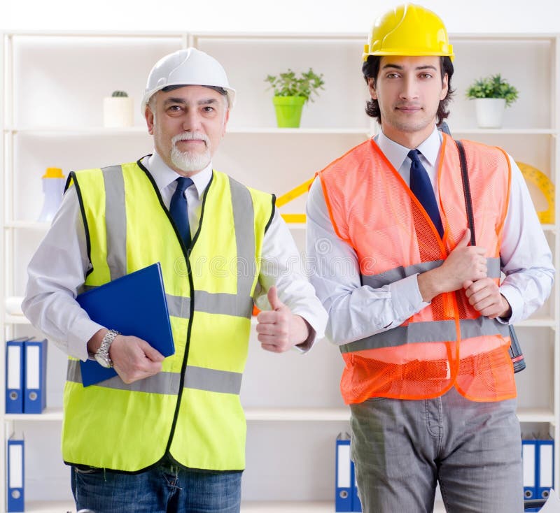 Two Engineers Colleagues Working Under Project Stock Image - Image of ...