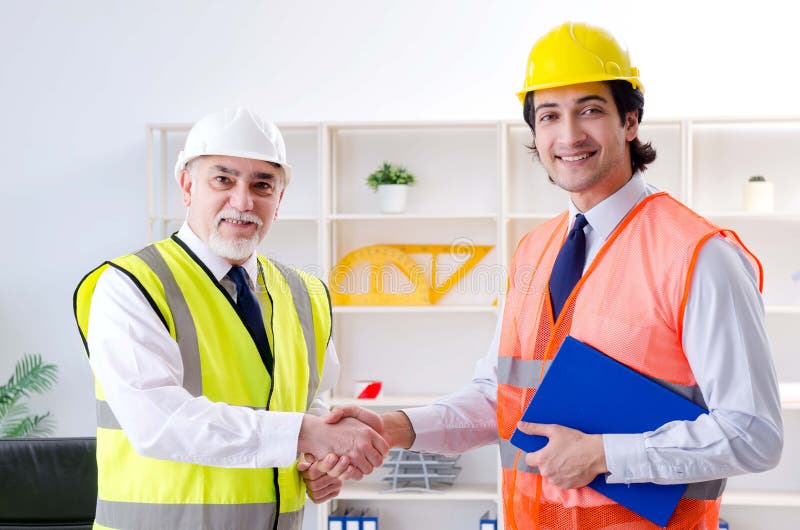 The Two Engineers Colleagues Working Under Project Stock Photo - Image ...