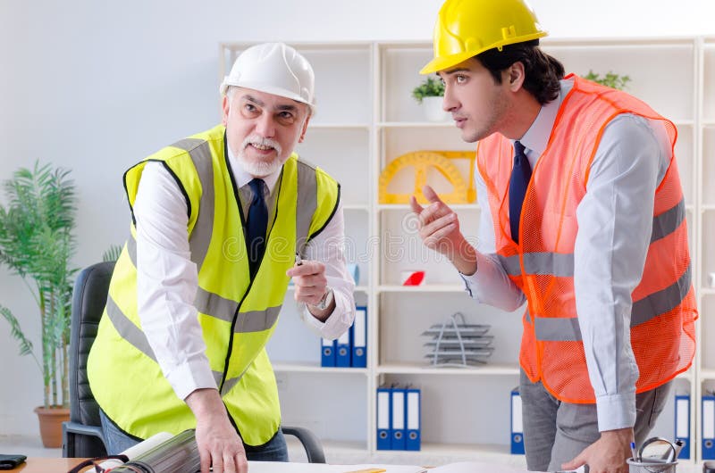 The Two Engineers Colleagues Working Under Project Stock Photo - Image ... The Two Engineers Colleagues Working Under Project Stock Photo - Image ...