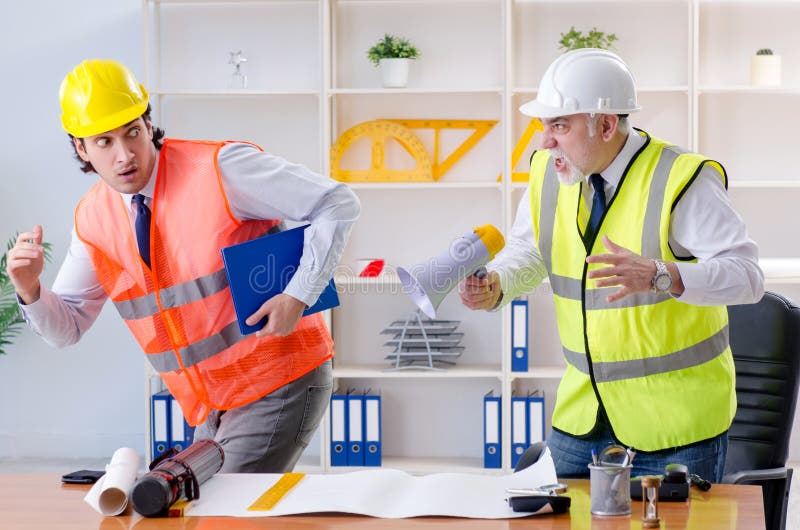 The Two Engineers Colleagues Working Under Project Stock Image - Image ...