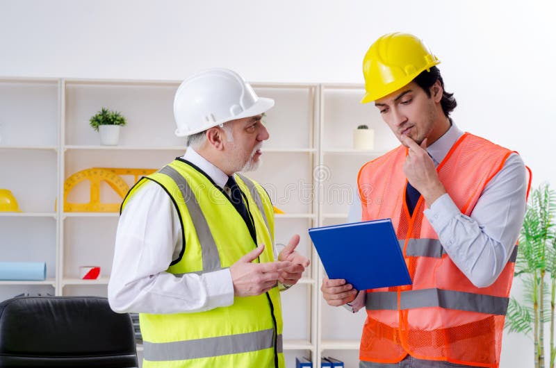The Two Engineers Colleagues Working Under Project Stock Image - Image ... The Two Engineers Colleagues Working Under Project Stock Image - Image ...