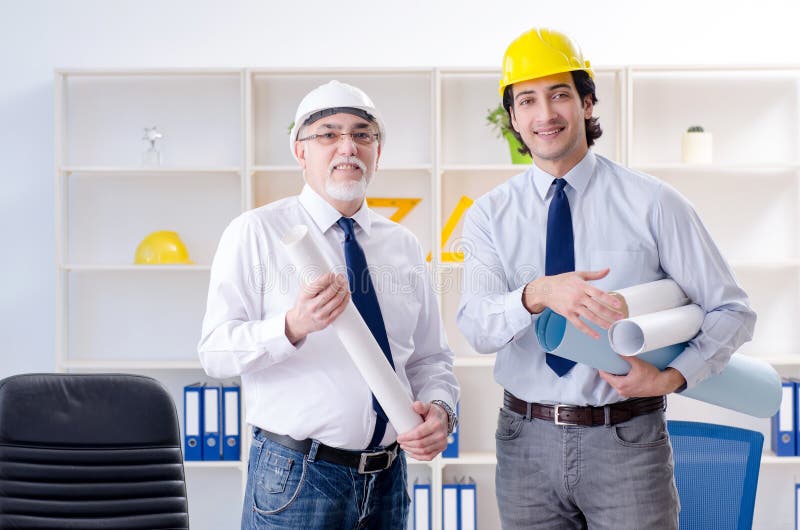 The Two Engineers Colleagues Working Under Project Stock Photo - Image ...