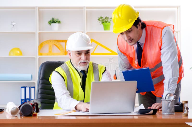 The Two Engineers Colleagues Working Under Project Stock Image - Image ...