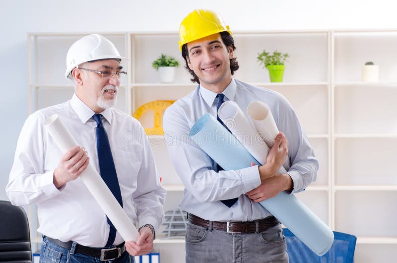 The Two Engineers Colleagues Working Under Project Stock Image - Image ...