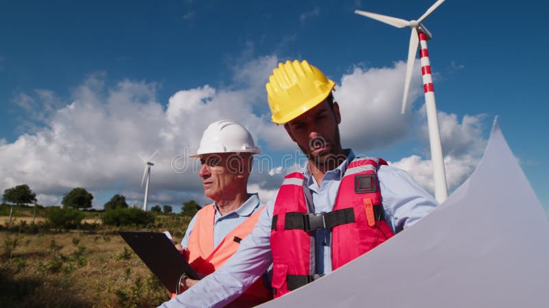 Engineers Cooperating during Work Under Wind Turbine Construction Stock ...
