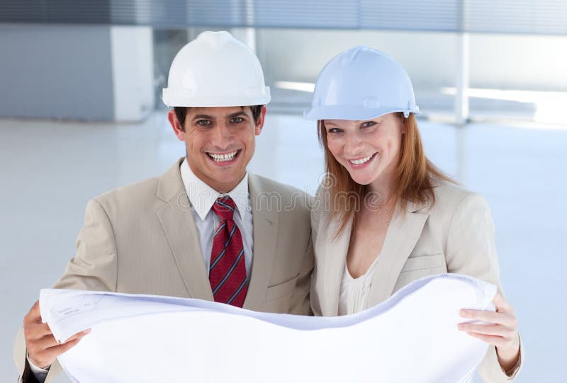 Two Engineers Discussing a Construction Project Stock Image - Image of ...