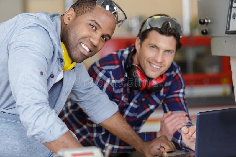 Two Engineers Discussing at Workshop Stock Photo - Image of automated ...