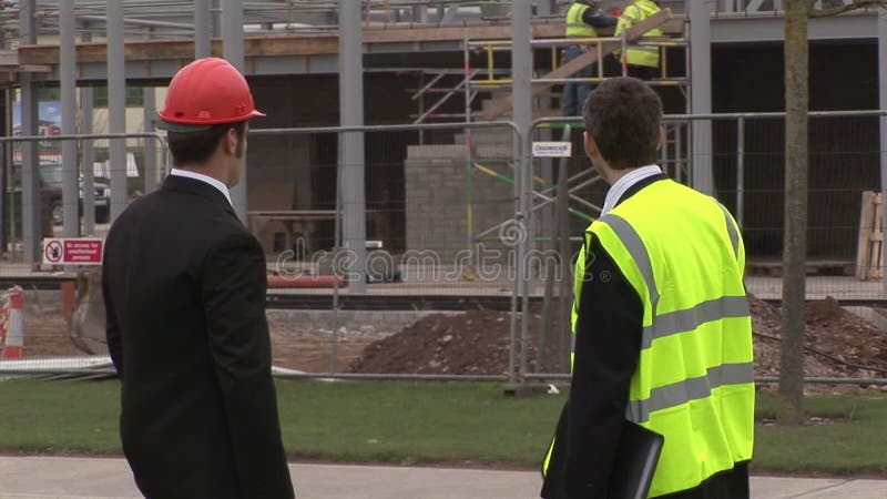 Engineer or Architect Discussing Construction Issues with Colleagues ...