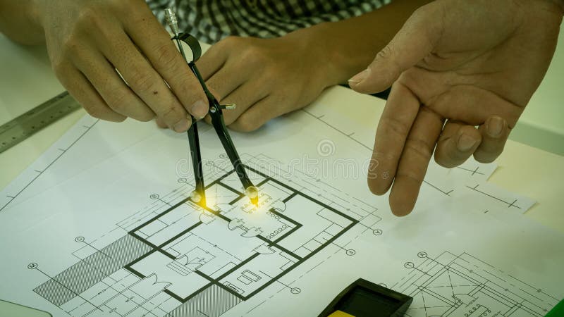 Two Engineers are Drawing a House Plan To Plan the House Stock Photo ...