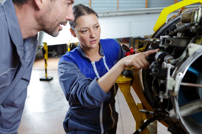 Two Engineers Fixing Engine Stock Photo - Image of industrial, flight ...