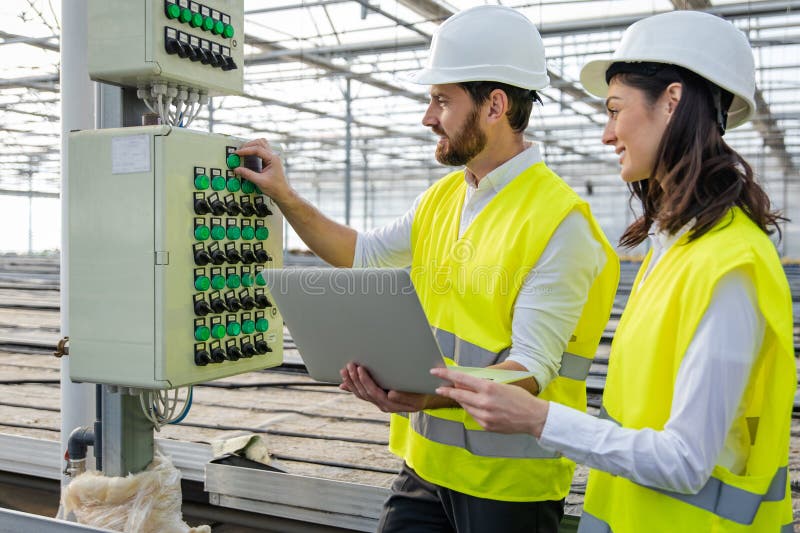 Two Engineers Inspecting Construction Site and Looking Involved Stock ...