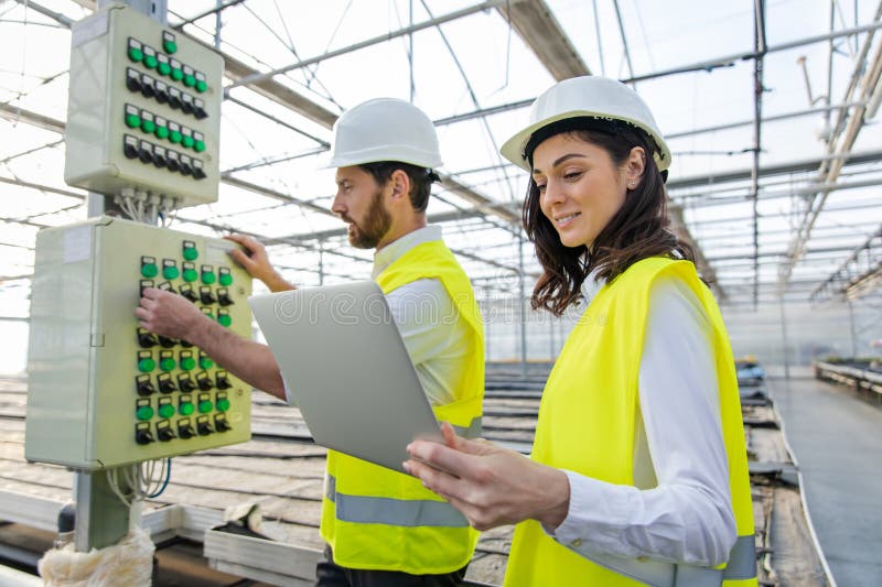 Two Engineers Inspecting Construction Site and Looking Involved Stock ...