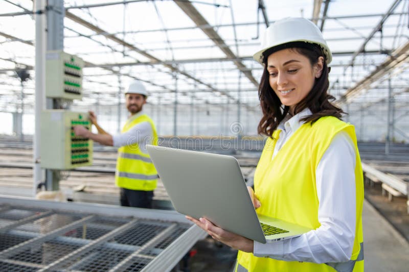 Two Engineers Inspecting Construction Site and Looking Involved Stock ...