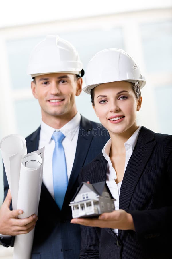 Two Engineers Keeping Blueprints and Model House Stock Image - Image of ...