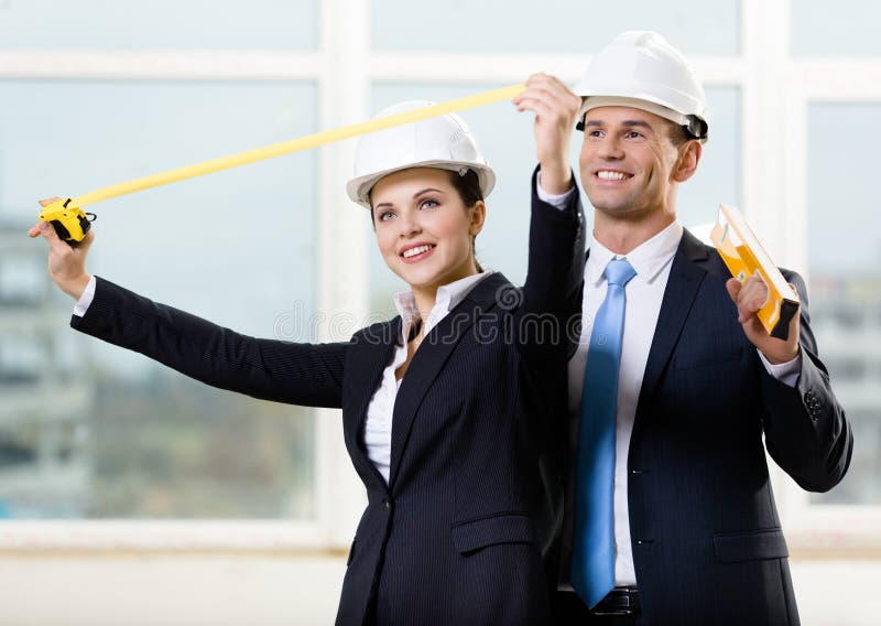 Two Engineers Keeping Level and Tape Measure Stock Photo - Image of ...