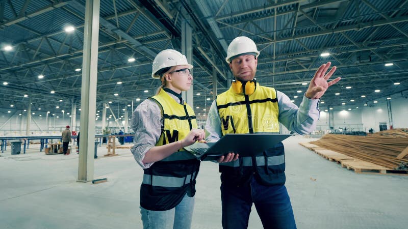 Two Engineers Working at a Modern Factory Workplace Stock Video - Video ...