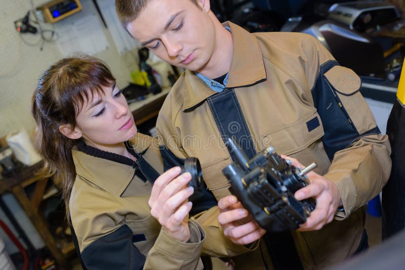 Two Engineers Looking at Mechanical Part Stock Photo - Image of broken ...