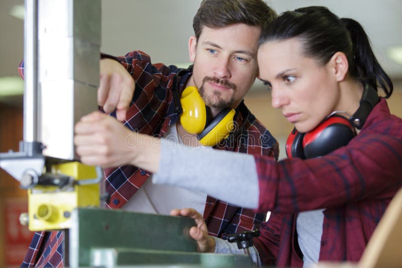 Two Engineers Operating Cnc Machinery on Factory Floor Stock Image ...